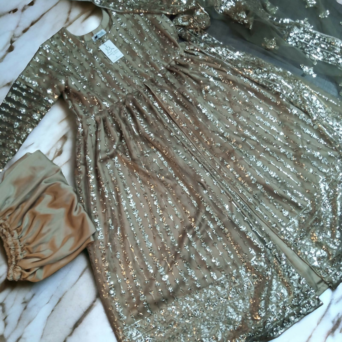 Elegant golden net frock adorned with sequins – perfect for parties ...